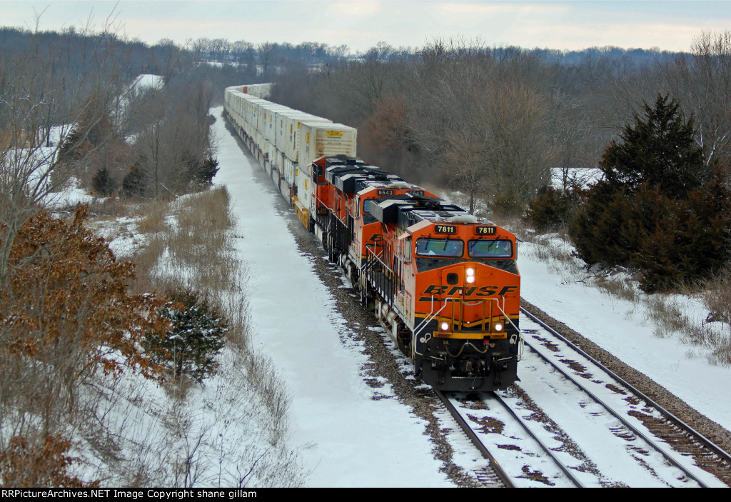 BNSF 7811 Race's Eb vith a hot stack train.